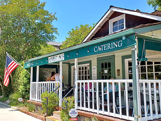 A charming Craftsman bungalow transformed into breakfast paradise, Marston's welcomes you with a white picket fence and American flag—home before you even walk in.