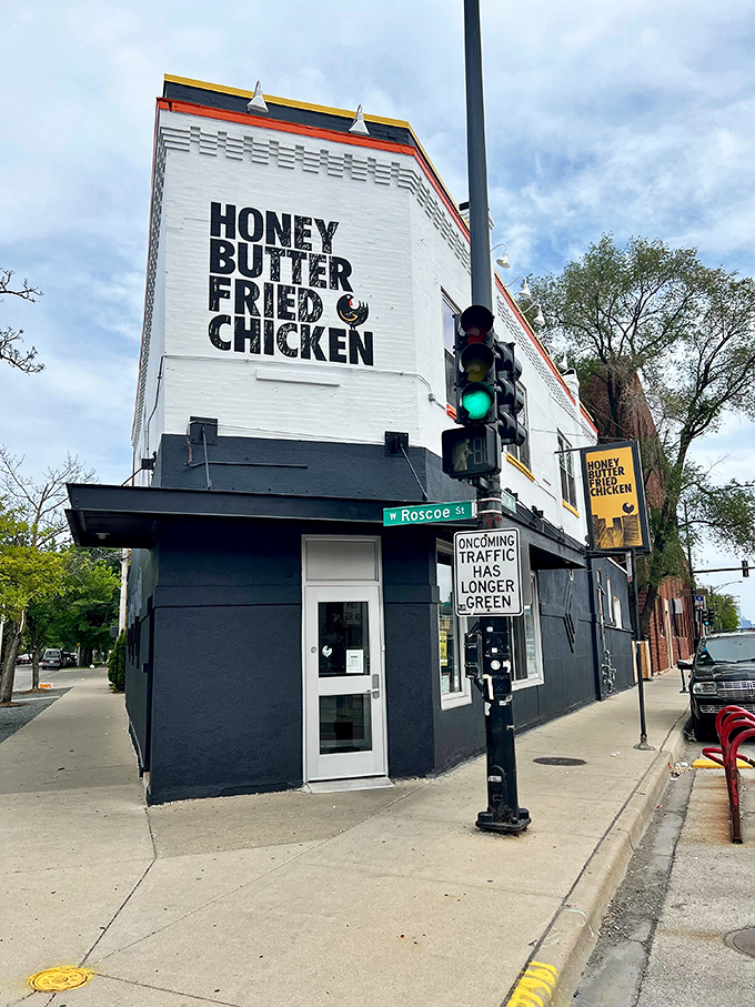 The white-and-navy exterior stands like a beacon of comfort food promise. Bold lettering leaves no doubt about what delicious treasures await inside.