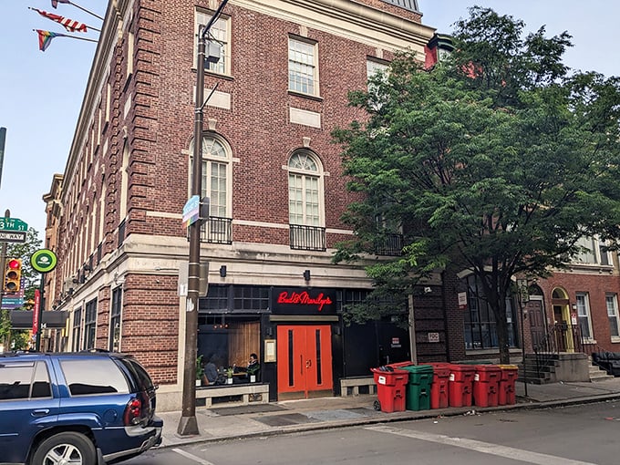 Those iconic red doors against historic Philadelphia brick aren't just an entrance—they're a portal to comfort food nirvana.