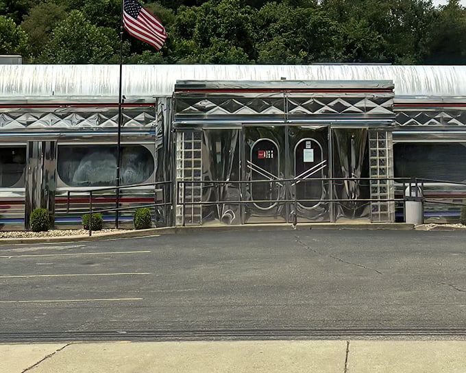 That American flag isn't just patriotic decoration—it's signaling to hungry travelers that this stainless steel sanctuary houses some of the most American breakfast experiences possible.