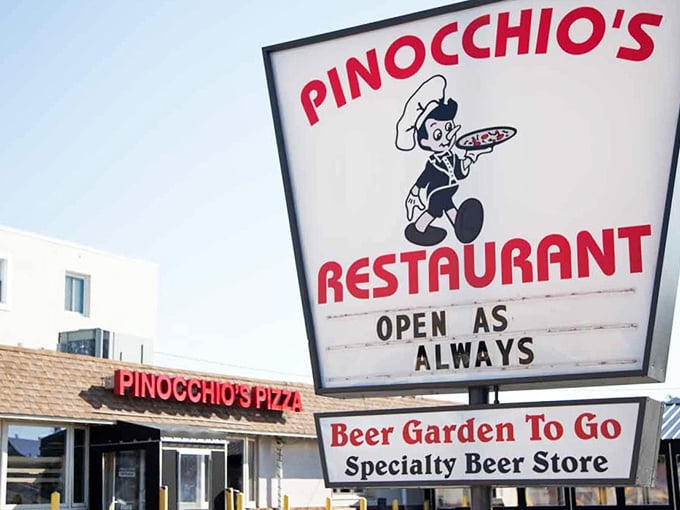 The iconic Pinocchio's sign promises pizza perfection with its cheerful cartoon mascot. "Open As Always" isn't just a slogan—it's a delicious commitment to the community.