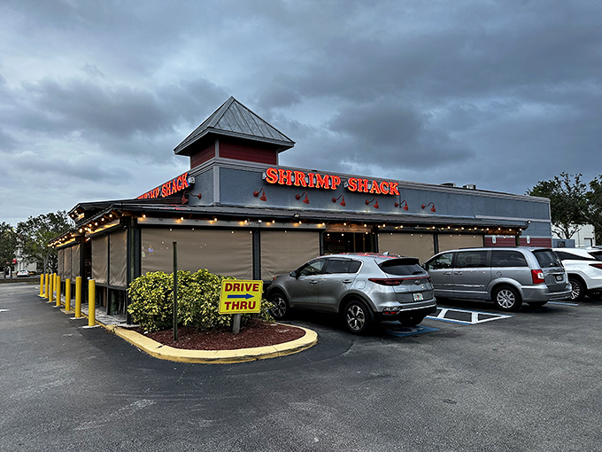 The unassuming exterior of Shrimp Shack belies the seafood treasures within. That drive-thru sign? A blessing for those days when pants feel optional.