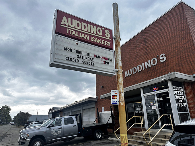 The unassuming brick exterior of Auddino's might not scream "food destination," but locals know this sign marks the spot where carb dreams come true.
