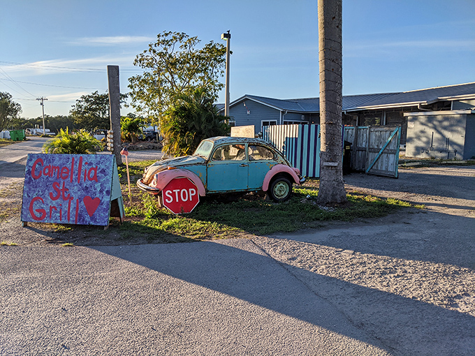 The vintage teal Beetle and hand-painted sign aren't just quirky landmarks—they're your first clue you've found Florida's most delightful hidden treasure.