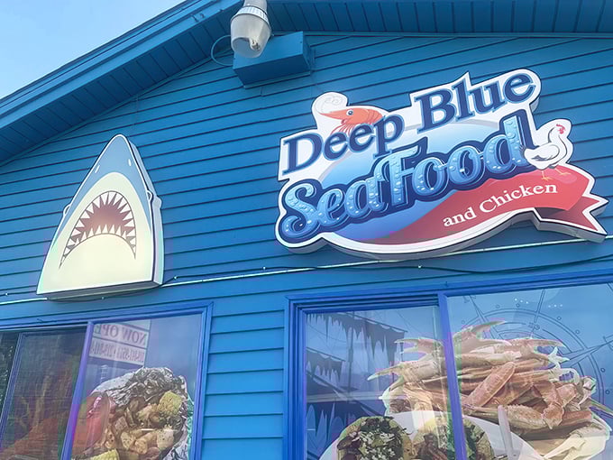 Outside, Deep Blue Seafood pops like a roadside postcard—shark grin, bold colors, and a promise of flavor.