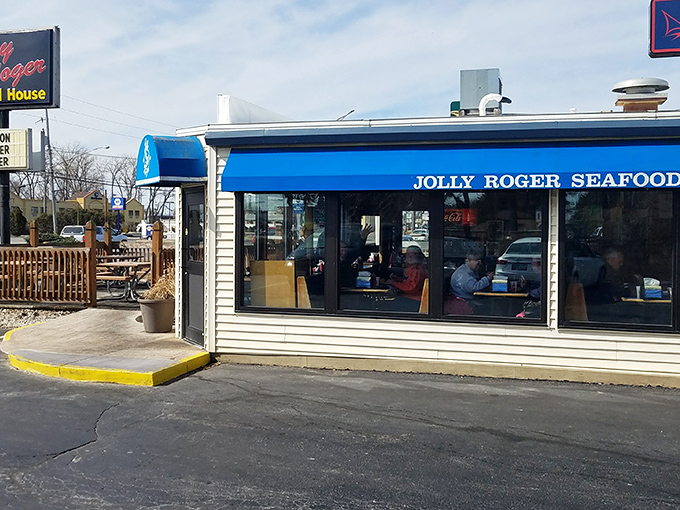The unassuming blue awning of Jolly Roger Seafood House beckons like a lighthouse for hungry travelers. Lake Erie's seafood sanctuary hides in plain sight.