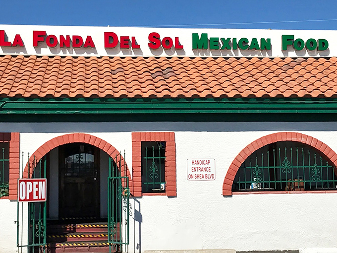 The unassuming exterior of La Fonda Del Sol beckons with its classic Spanish-style roof and distinctive red-trimmed arches—proof that culinary treasures often hide in plain sight.