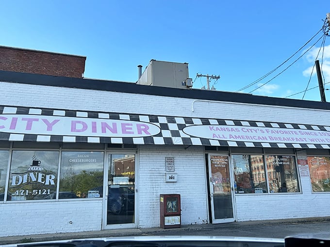 The checkered facade of City Diner stands like a culinary lighthouse on Grand Boulevard, beckoning hungry souls with promises of breakfast nirvana.