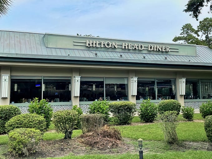 The iconic blue roof of Hilton Head Diner stands out like a culinary lighthouse, beckoning hungry travelers with promises of breakfast bliss and comfort food classics.