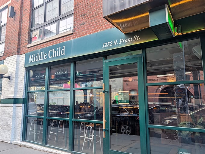 The green awning beckons like an old friend on Fishtown's Front Street, promising comfort food with a twist inside this brick-faced beauty.
