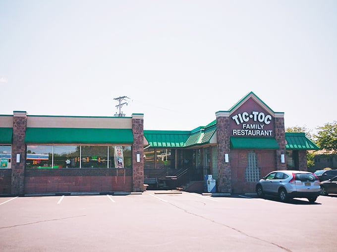 The green-roofed sanctuary of comfort food stands like a beacon for hungry travelers. Tic-Toc's unassuming exterior hides culinary treasures waiting to be discovered.