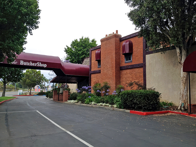 The brick façade and burgundy awning of The Butcher Shop stand ready to welcome hungry patrons. Like a carnivore's lighthouse beckoning you to safe harbor.