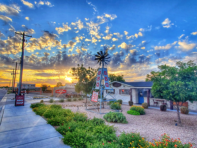 The corrugated metal exterior isn't just Texas-inspired architecture—it's a smoke signal to BBQ pilgrims that authentic Central Texas-style goodness awaits inside.