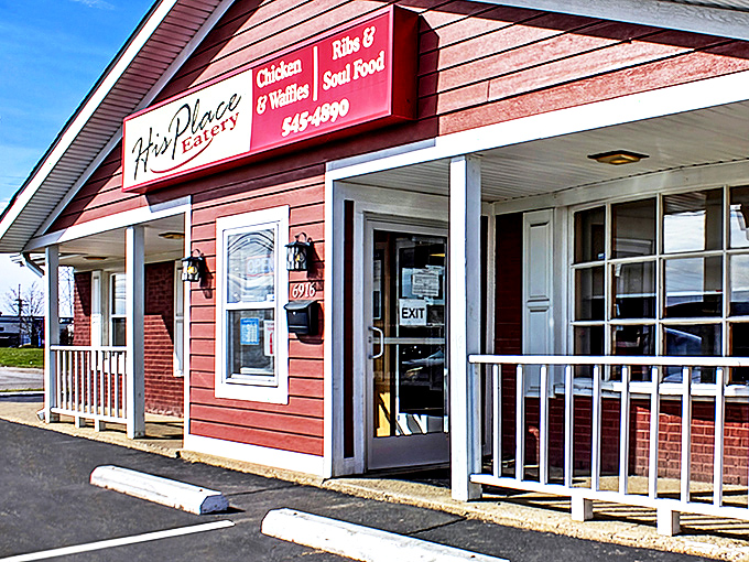 The barn-red exterior of His Place Eatery stands as a beacon of comfort food promise on Indianapolis's east side.