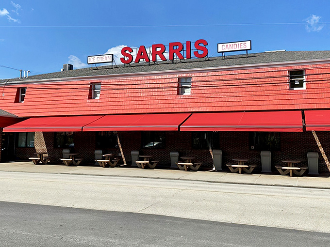 The iconic red-shingled roof of Sarris Candies beckons like a lighthouse for sweet-toothed travelers, with a cheerful storefront that invites visitors inside for a world of chocolate delights.
