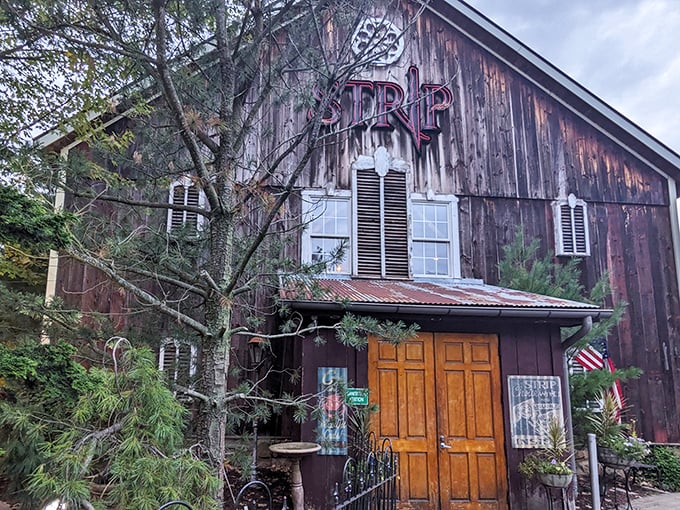 This weathered barn exterior whispers promises of something extraordinary happening inside – and boy, does it deliver on that promise.