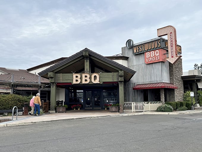 This rustic facade promises serious barbecue business – where corrugated metal meets carnivorous dreams in perfect harmony.