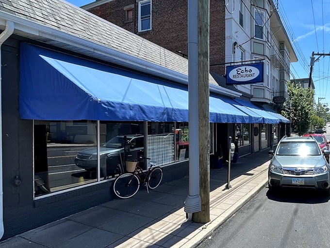 The blue awnings of The Echo beckon like an old friend on Edwards Road, promising comfort food and conversations that matter.