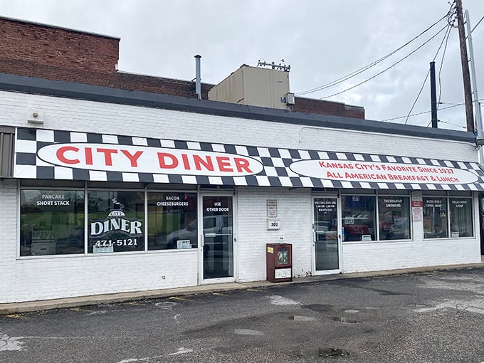 The checkered facade of City Diner stands like a culinary lighthouse on Grand Boulevard, beckoning hungry souls with promises of breakfast nirvana.
