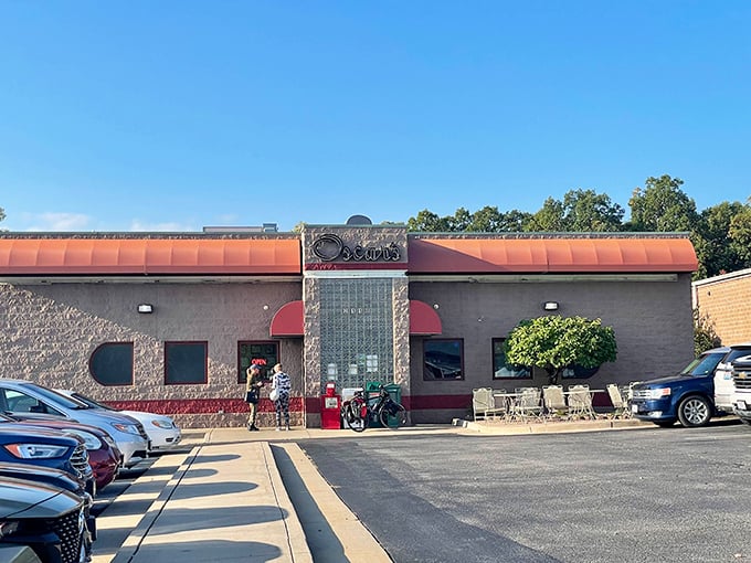 Oscar's welcoming exterior beckons hungry travelers with its distinctive stone facade and copper-colored awnings—a Jefferson City landmark promising comfort food paradise within.