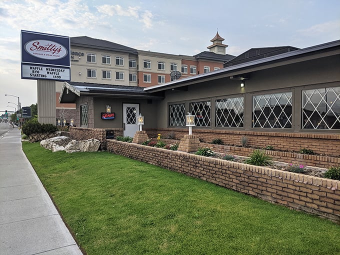 Smitty's welcomes hungry travelers with its classic brick exterior and iconic sign—a beacon of breakfast hope on Idaho Falls' horizon.