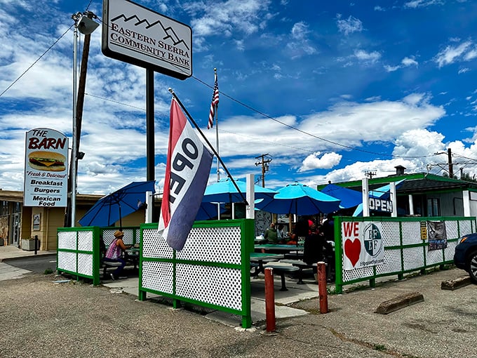 The Barn's cheerful green trim and blue umbrellas stand out against the Eastern Sierra sky like a mirage for hungry travelers on Highway 395.