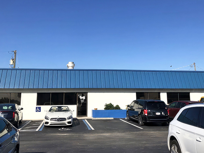 The unassuming blue-roofed exterior of The Blueberry Muffin might not scream "culinary destination," but locals know this Indialantic treasure is where breakfast dreams come true.