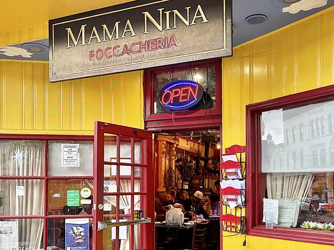 That cheerful yellow facade practically shouts "Come in and eat!" – Italian hospitality begins before you even cross the threshold.