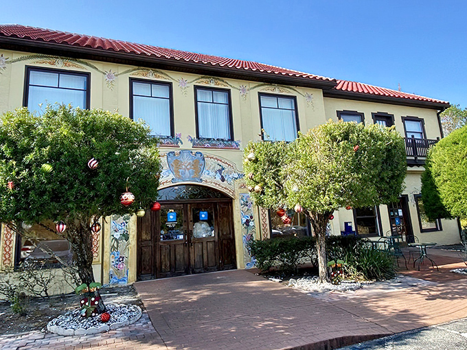 The cream-colored façade with red-tiled roof isn't just a building—it's a portal to Bavaria that somehow landed in Central Florida, complete with charming wooden doors and lush greenery.