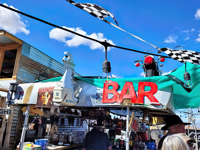Checkered flags and desert skies welcome hungry travelers to this roadside oasis. The BAR sign isn't lying – expectations will definitely be raised.