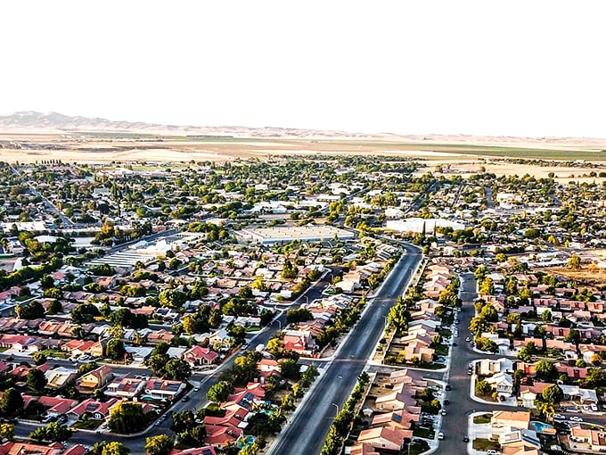 Aerial view of Coalinga reveals a patchwork of terracotta roofs and tree-lined streets, where California sunshine meets small-town charm without the big-city price tag.