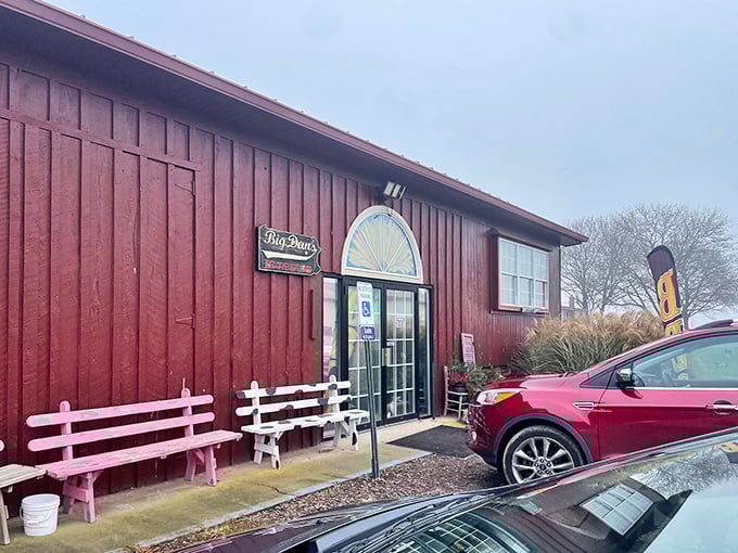 The red barn exterior of Big Dan's isn't trying to impress you with fancy architecture—it's saving all that energy for what's smoking inside.