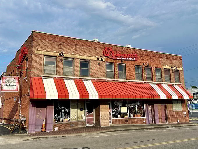 The iconic red sign against brick says it all – barbecue royalty lives here. That striped awning has welcomed hungry pilgrims for generations.