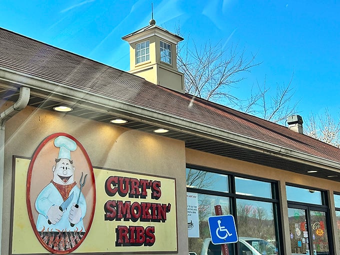 That iconic chef logo promises what awaits inside: barbecue so good it might make you consider moving to Mill Hall permanently.