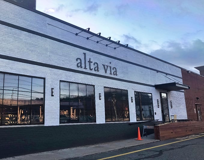 Alta Via's exterior at dusk captures that magical moment when anticipation of dinner becomes the highlight of your day.