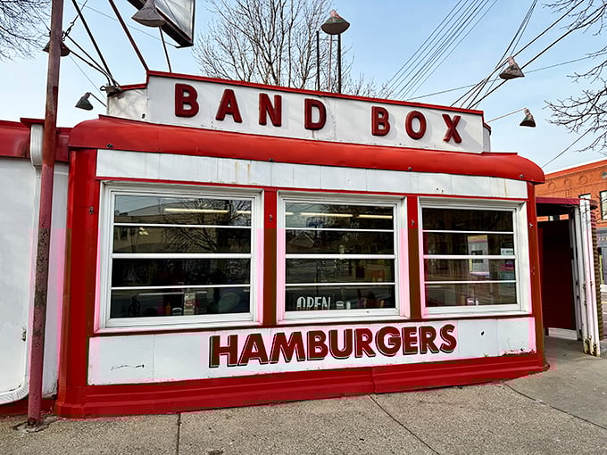 The iconic red-and-white exterior of Band Box Diner stands like a time capsule on the Minneapolis corner, promising nostalgic flavors and zero pretension.