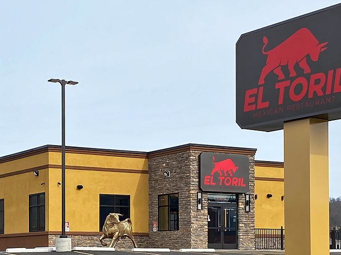 The golden-yellow exterior of El Toril stands proudly with its iconic red bull logo, like a beacon calling hungry travelers from miles around.