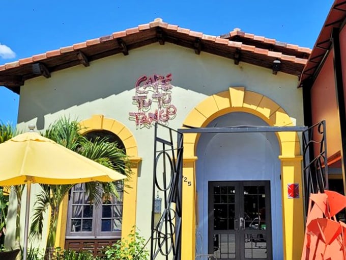 The Spanish-style exterior of Café Tu Tu Tango welcomes you with vibrant colors and quirky sculptures—like finding a Barcelona side street in the heart of Orlando.