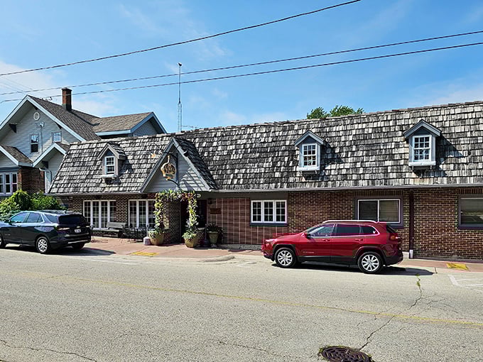 From the road, Schwarz's cedar shake roof and brick facade stand as a beacon to hungry travelers—Wisconsin's version of a lighthouse for the steak-starved.