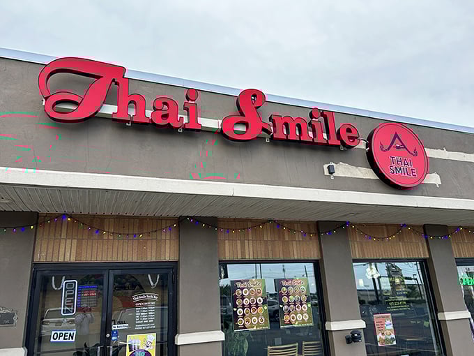 The bright red "Thai Smile" sign beckons like a culinary lighthouse in this unassuming strip mall. Who knew paradise was hiding between a nail salon and a dry cleaner?