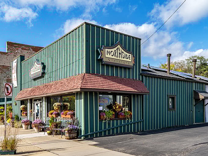 The teal-green beacon of breakfast bliss stands proudly on the corner, its distinctive siding practically whispering "come get some hash" to passing motorists.