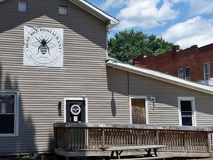 The unassuming exterior of Busy Bee Restaurant, where that iconic bee logo promises something sweet awaits inside this Marietta gem. 