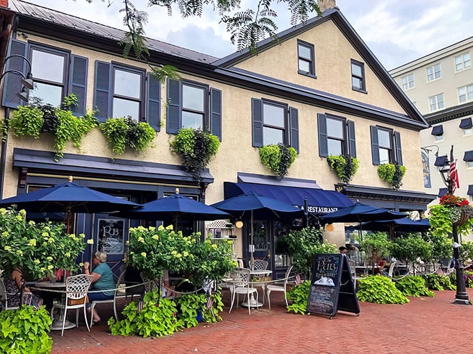 The stately yellow exterior with cascading greenery and navy awnings invites you in like a charming European café that happened to settle in historic Gettysburg.