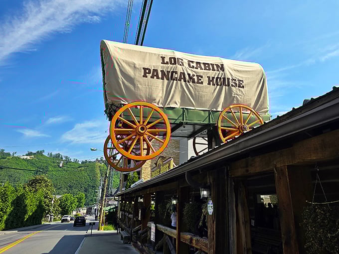 That covered wagon on the roof isn't just decoration—it's a beacon calling to hungry travelers like a breakfast lighthouse in the Smokies.