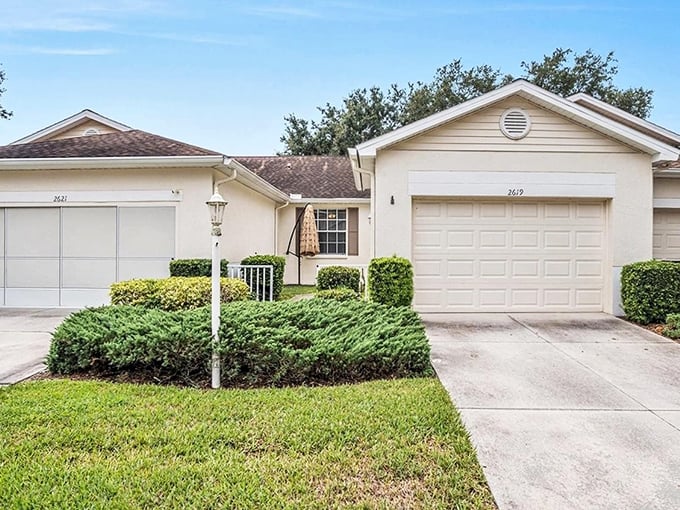 Well-maintained villas at Kings Point offer single-story living with manicured landscaping—Florida retirement without breaking the bank.