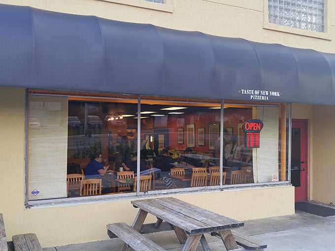 That blue awning might as well be a superhero cape – it's sheltering some of Ohio's most heroic pizza creations.