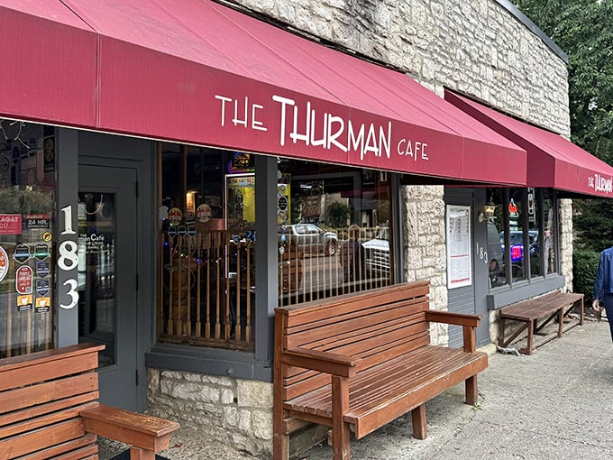 The iconic red awning of The Thurman Cafe beckons like a culinary lighthouse in Columbus' German Village. Simple wooden benches outside hint at the treasures within.