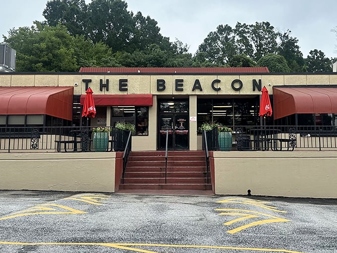 The iconic facade of The Beacon stands proud in Spartanburg, its red awnings beckoning hungry travelers like a culinary lighthouse on the South Carolina shore.