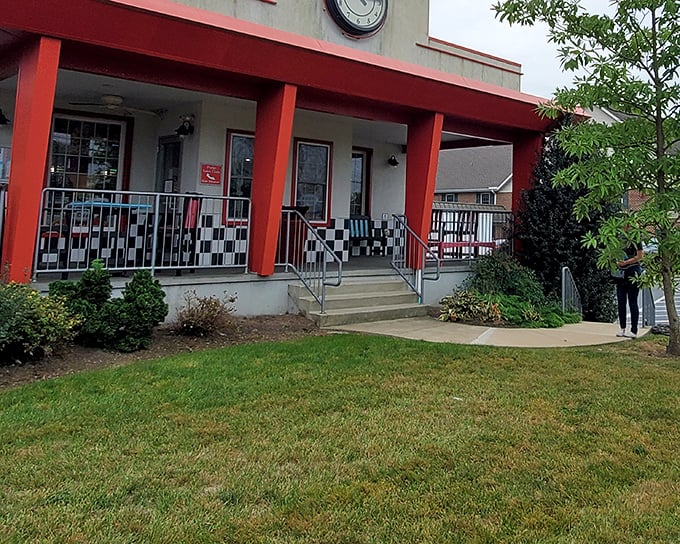 That checkerboard porch railing isn't just decorative—it's your first clue that you've found a place where nostalgia and flavor hold equal importance.
