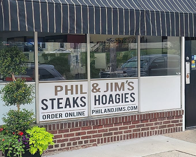 The unassuming storefront that houses sandwich greatness. Classic striped awning, brick facade, and zero pretension—just the way a legendary hoagie shop should be.